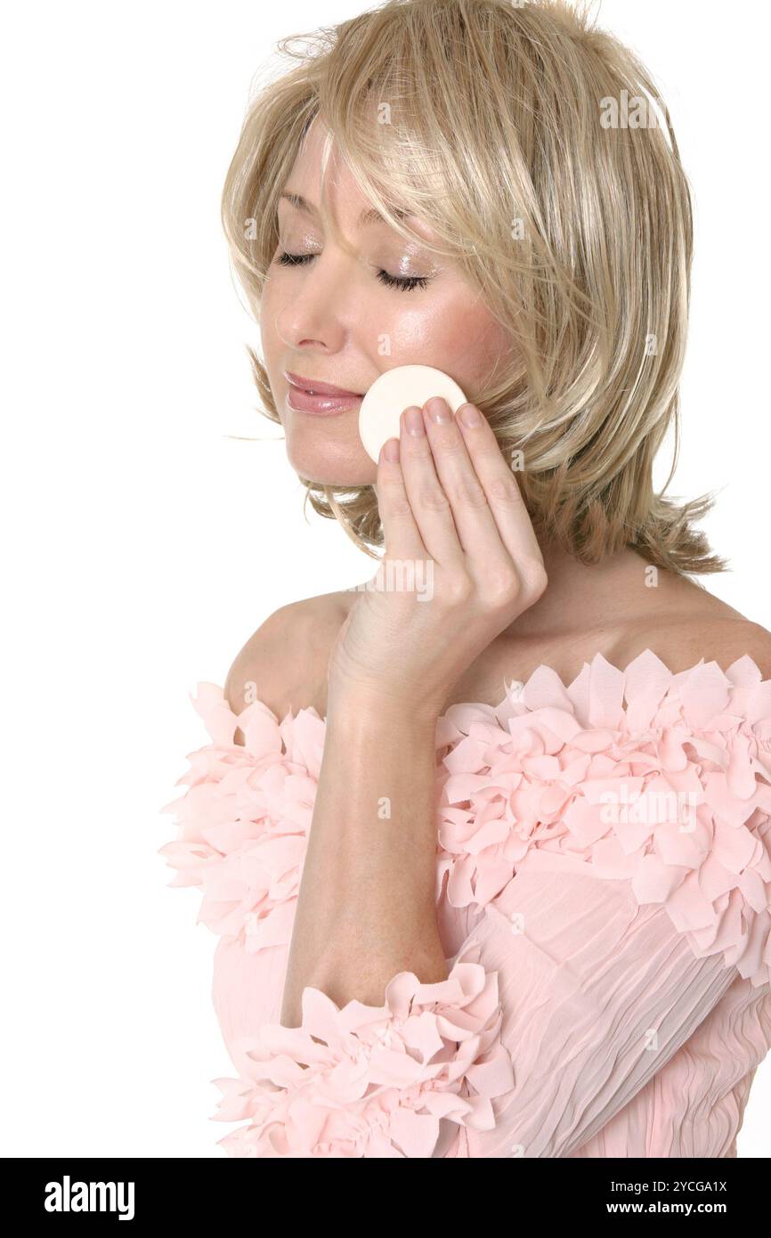 Woman using makeup applicator Stock Photo - Alamy