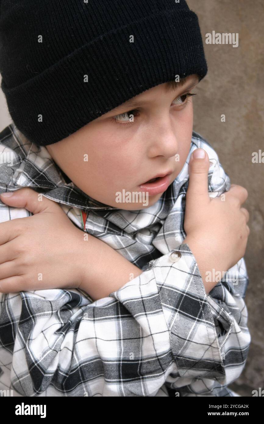 A homeless boy cold and lonely Stock Photo - Alamy