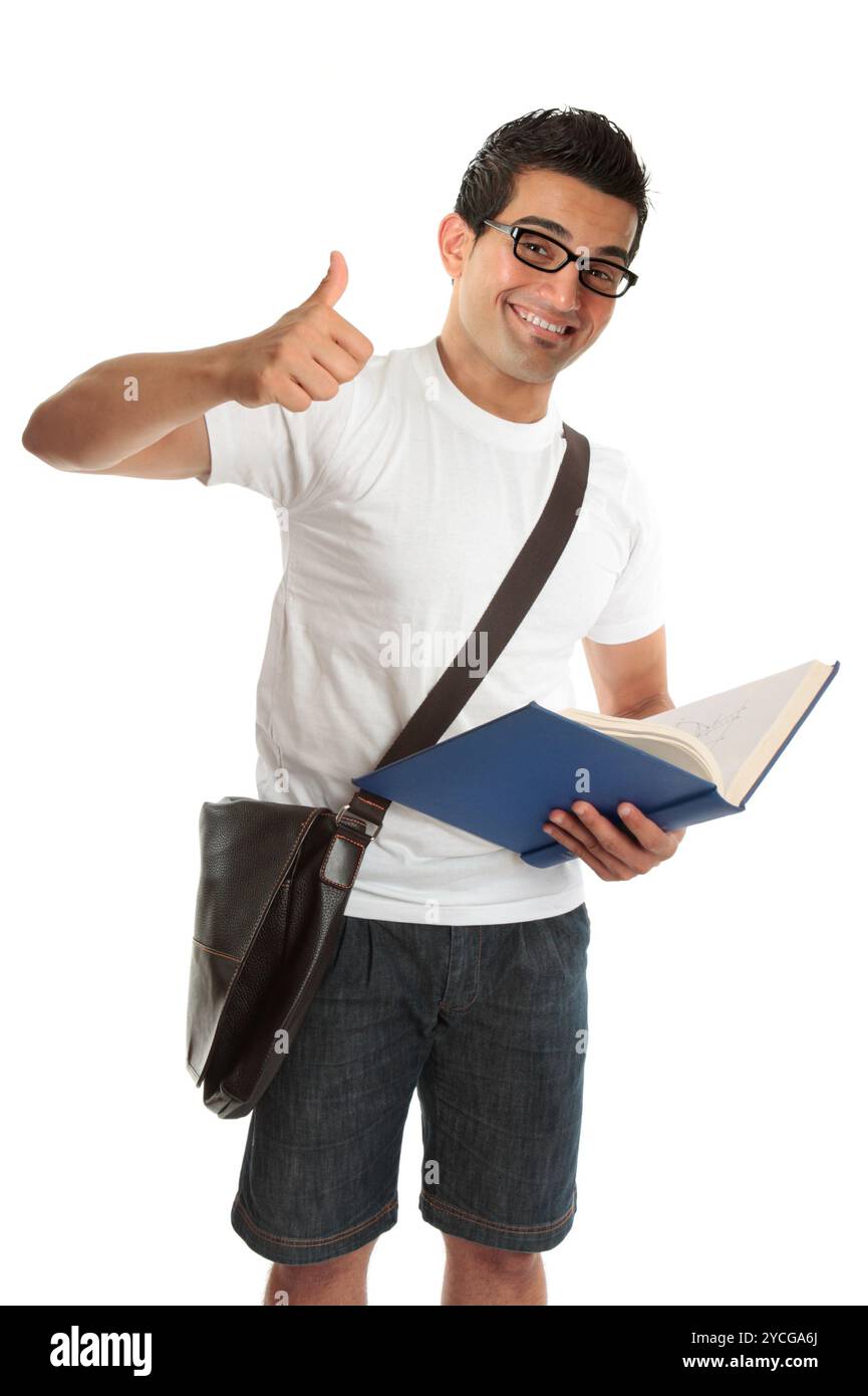 An excited happy university or college student, holding a text book and ...