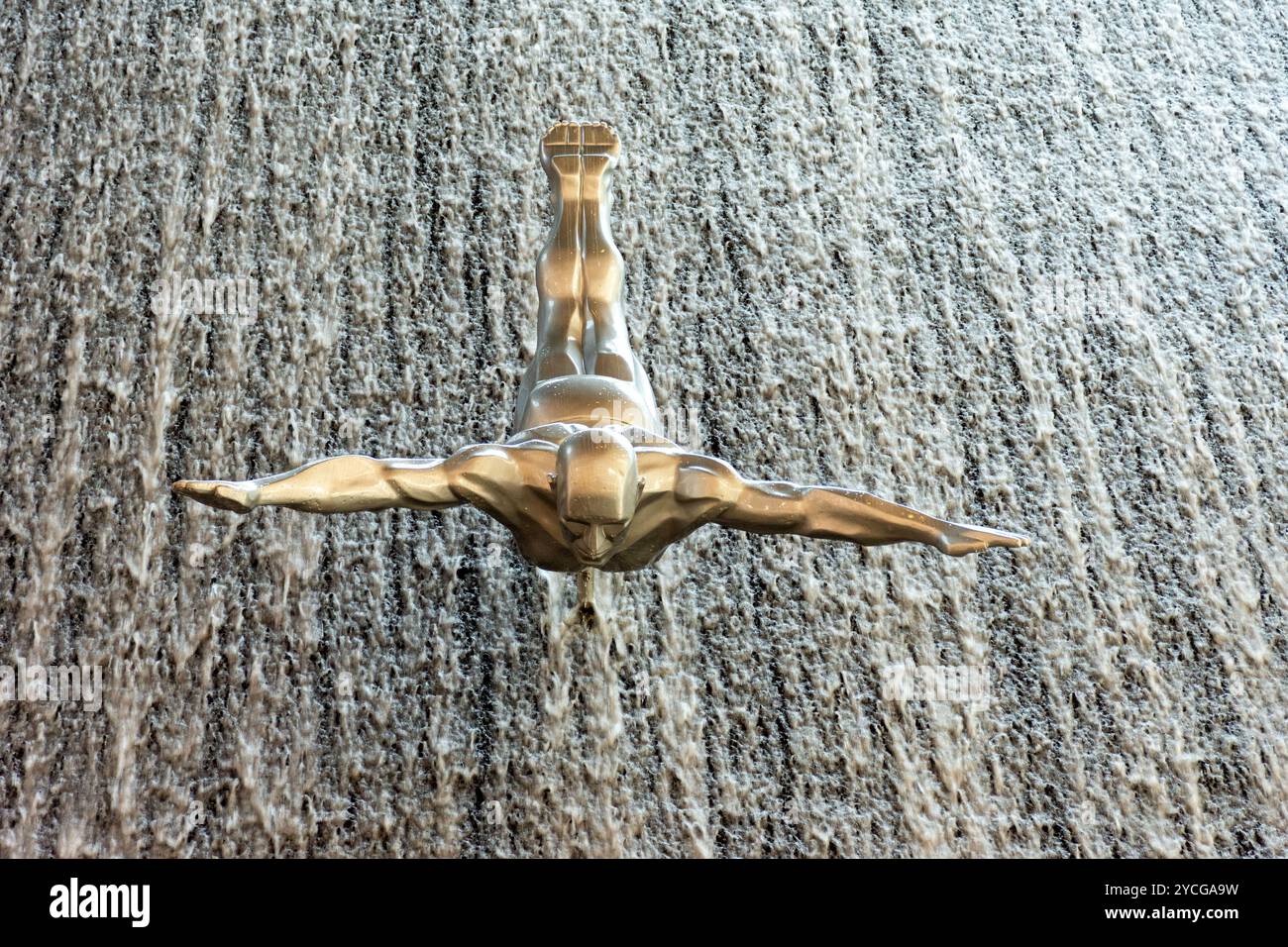 Diving men's sculptures of the iconic waterfall at the Dubai Mall in ...