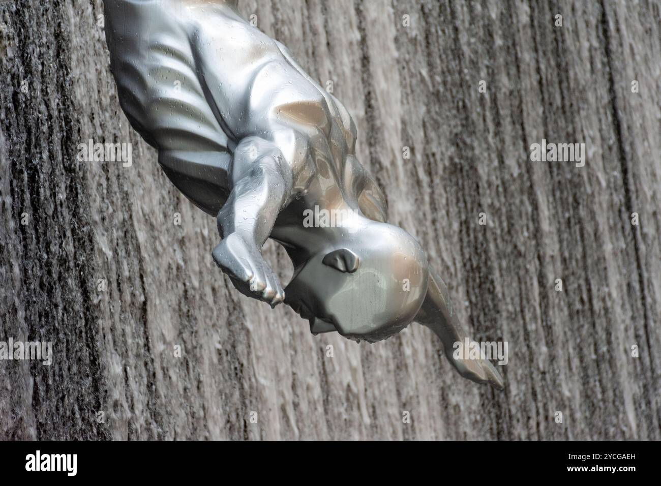 Diving men's sculptures of the iconic waterfall at the Dubai Mall in ...