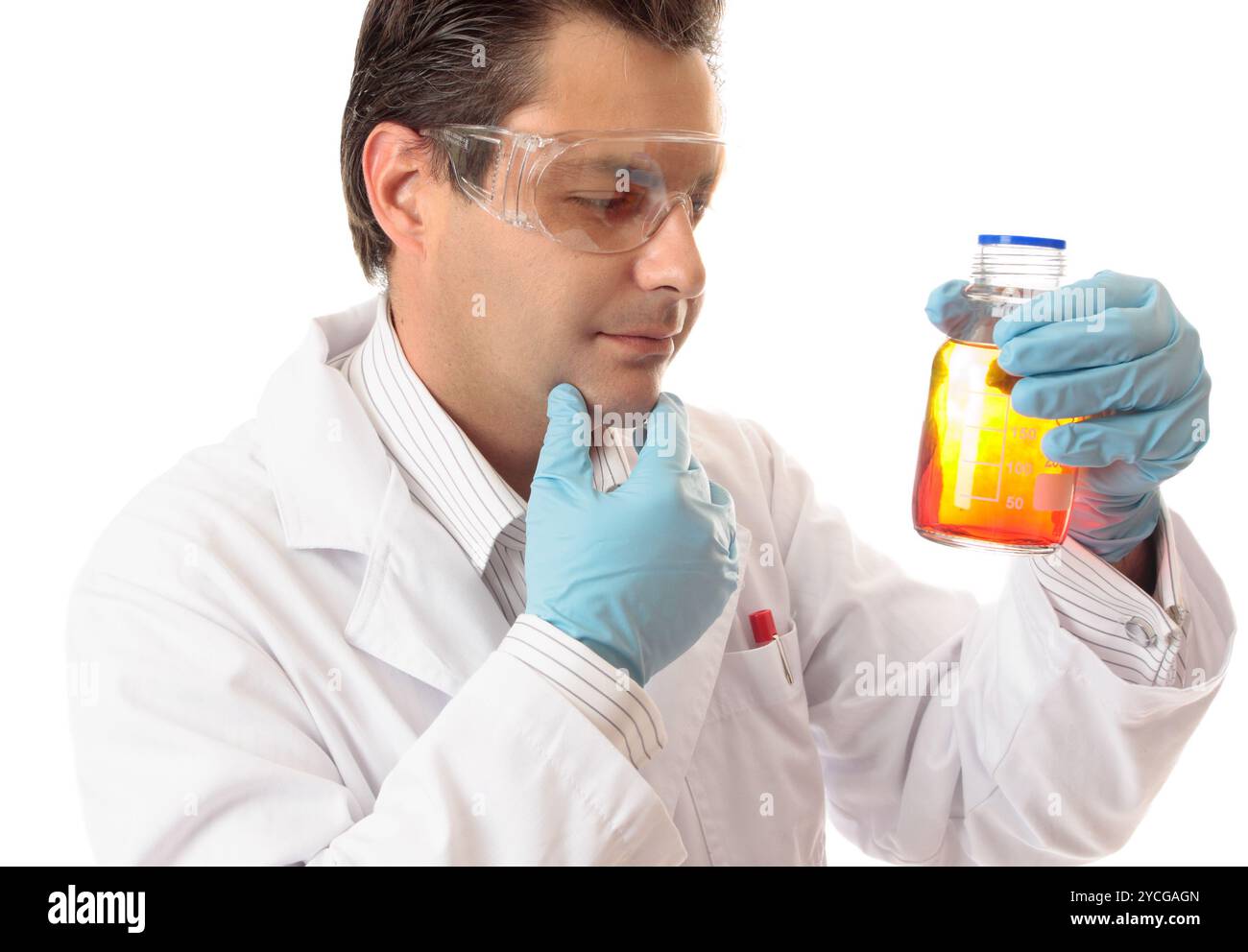 Chemist or other laboratory worker analysing and contemplating chemical ...