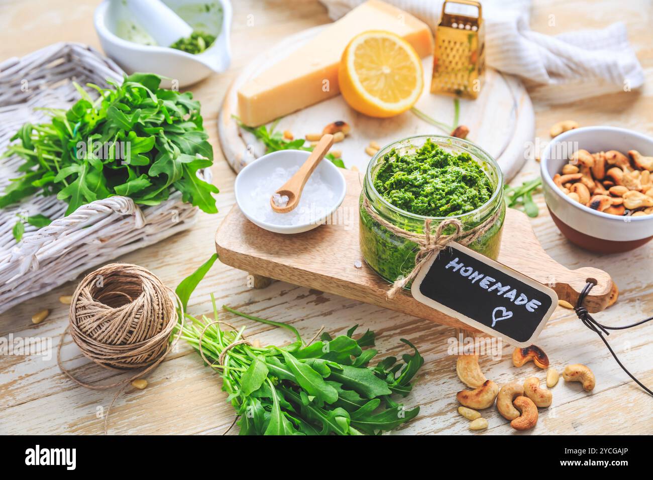 Homemade arugula pesto with lemon, nuts and parmesan cheese Stock Photo ...