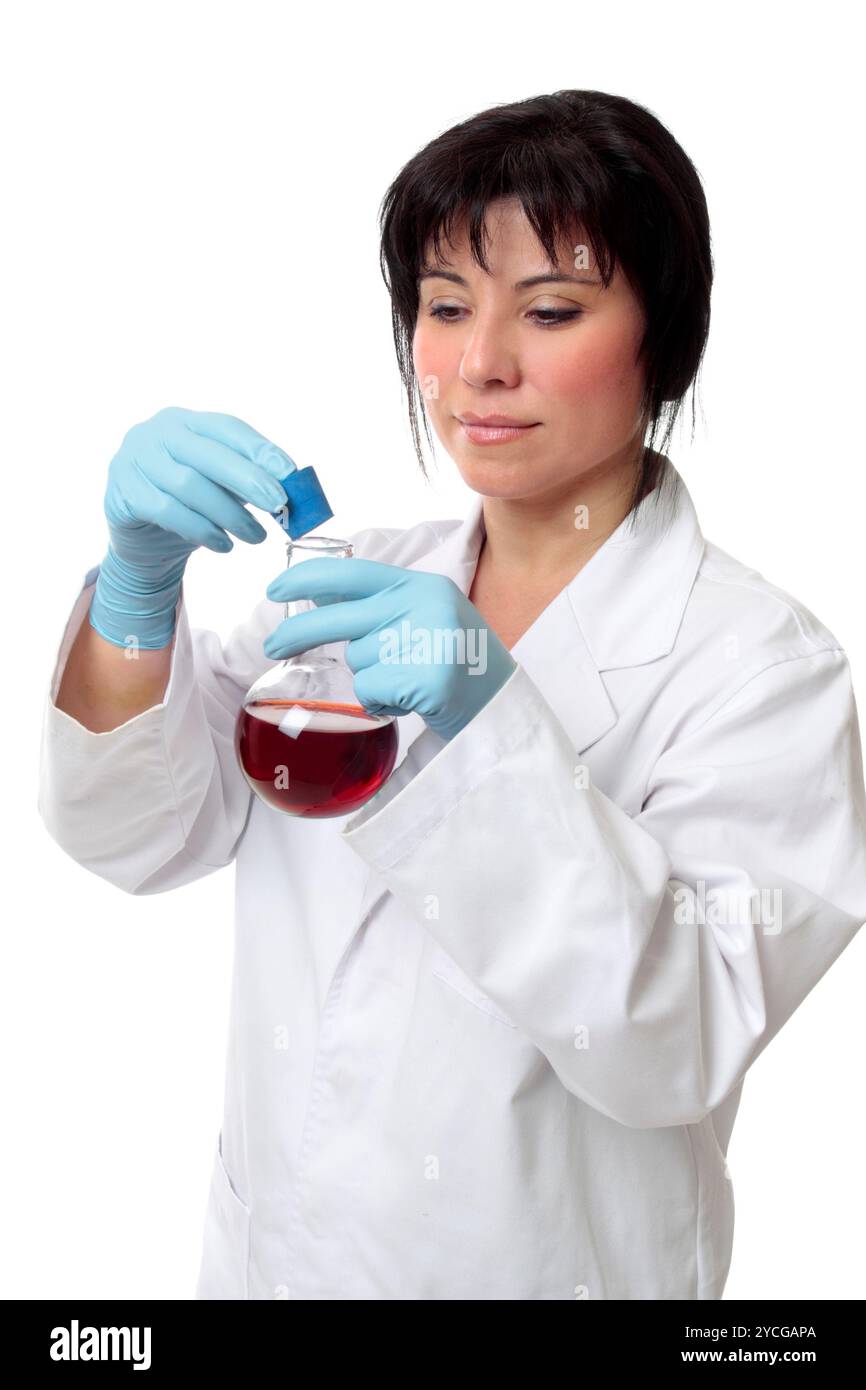 Chemist putting a rubber stopper in a round flask Stock Photo - Alamy