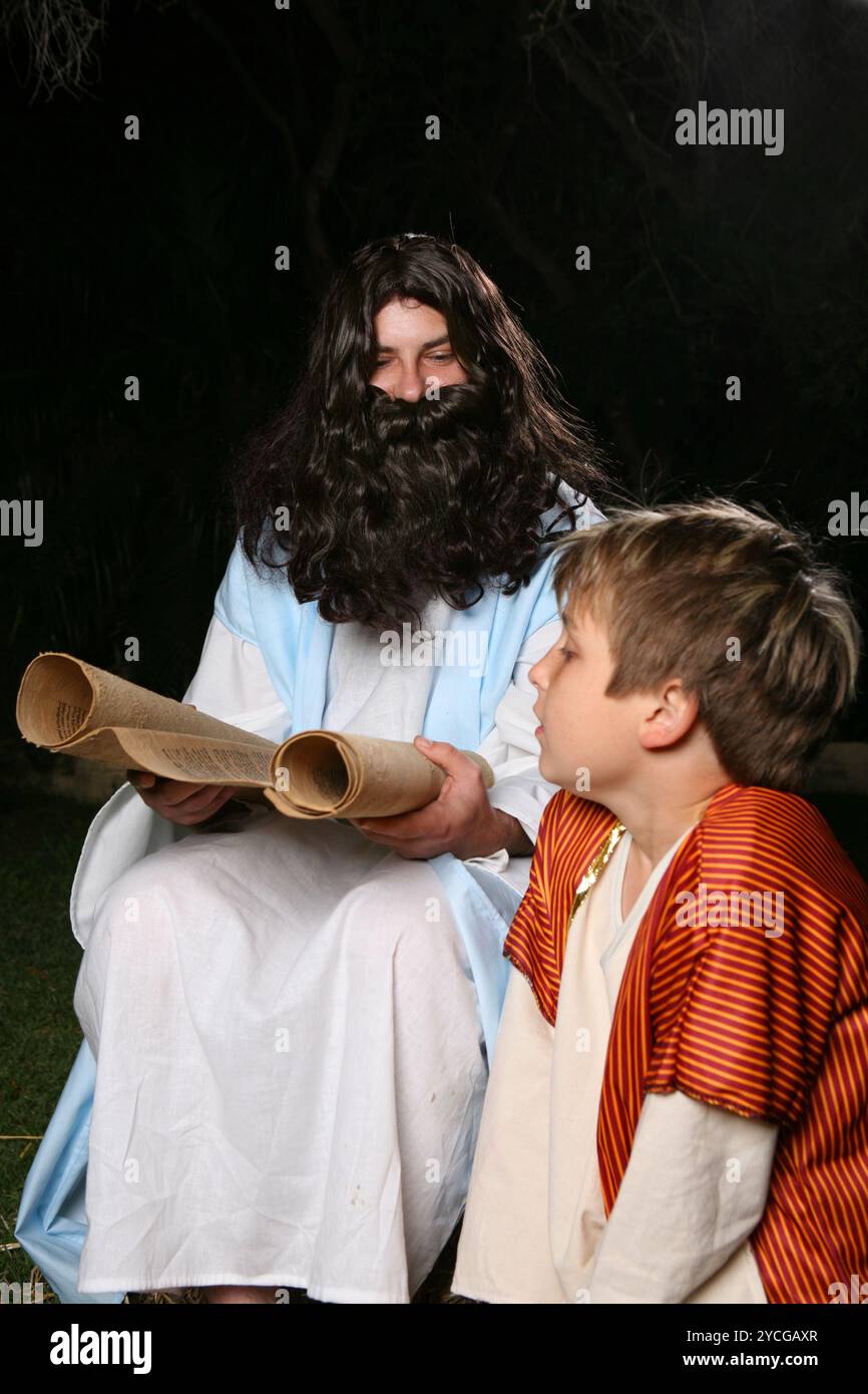 Reading bible scroll or other scroll Stock Photo - Alamy