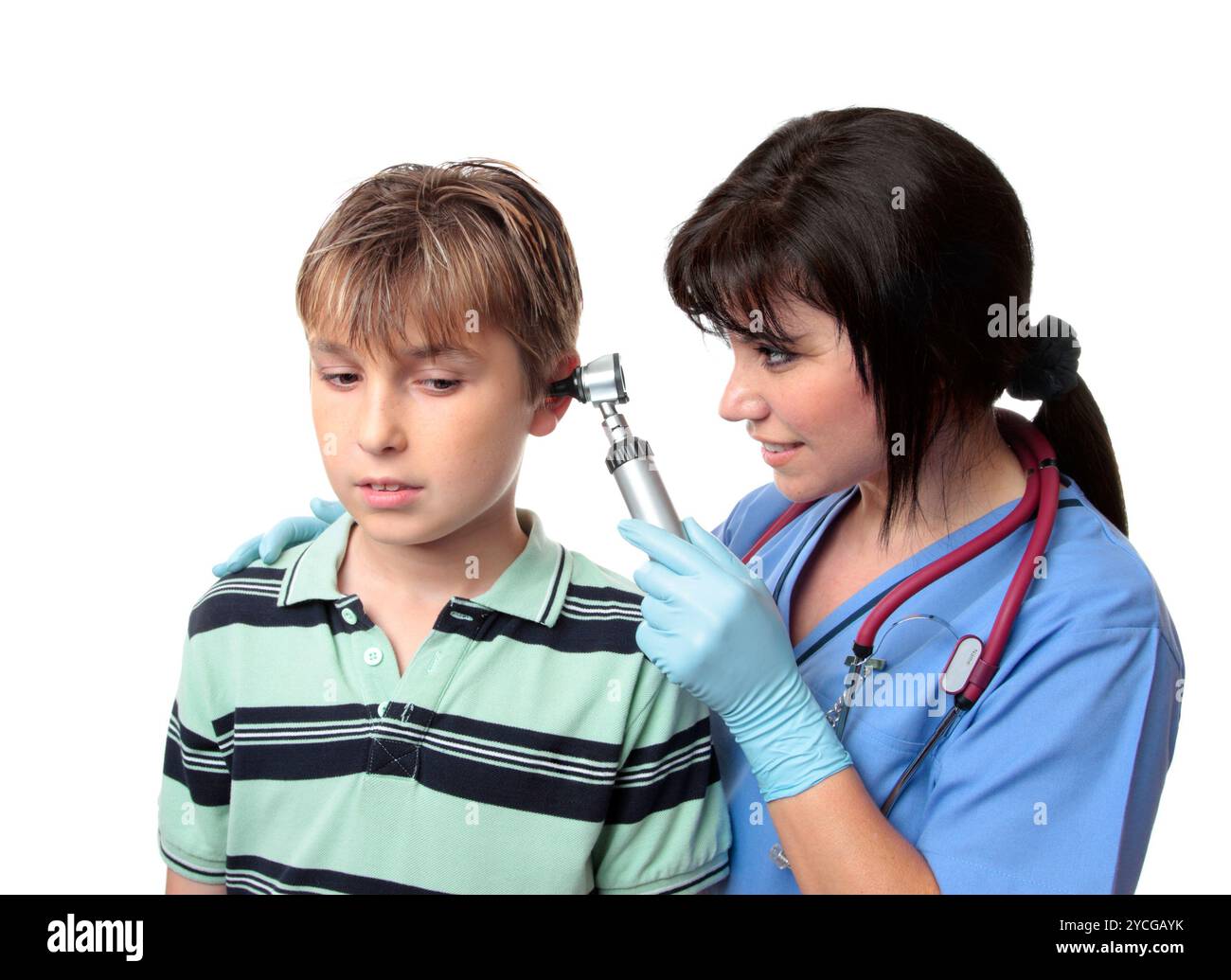 Doctor checking ears Stock Photo - Alamy