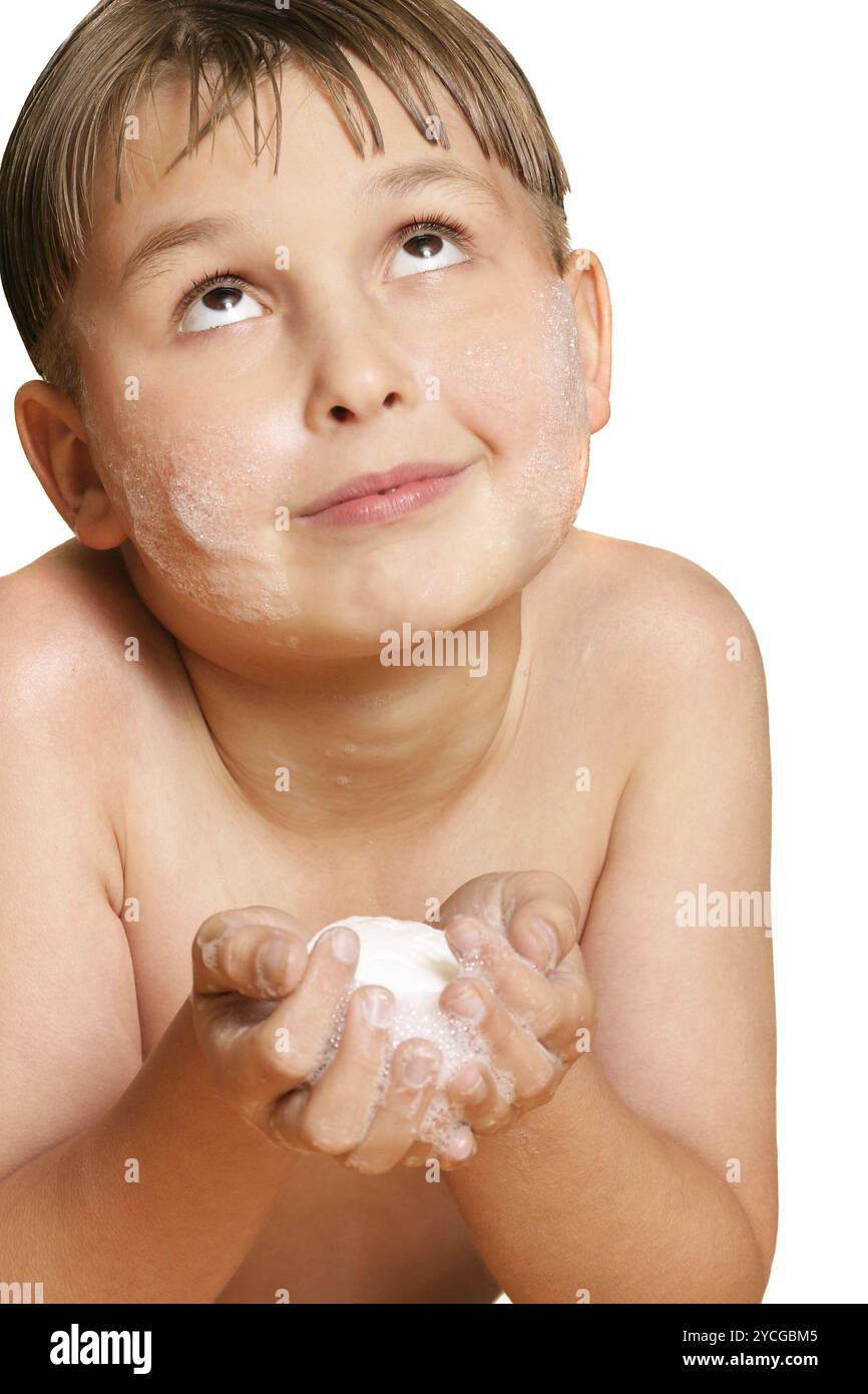 Boy washing face with soap Stock Photo - Alamy