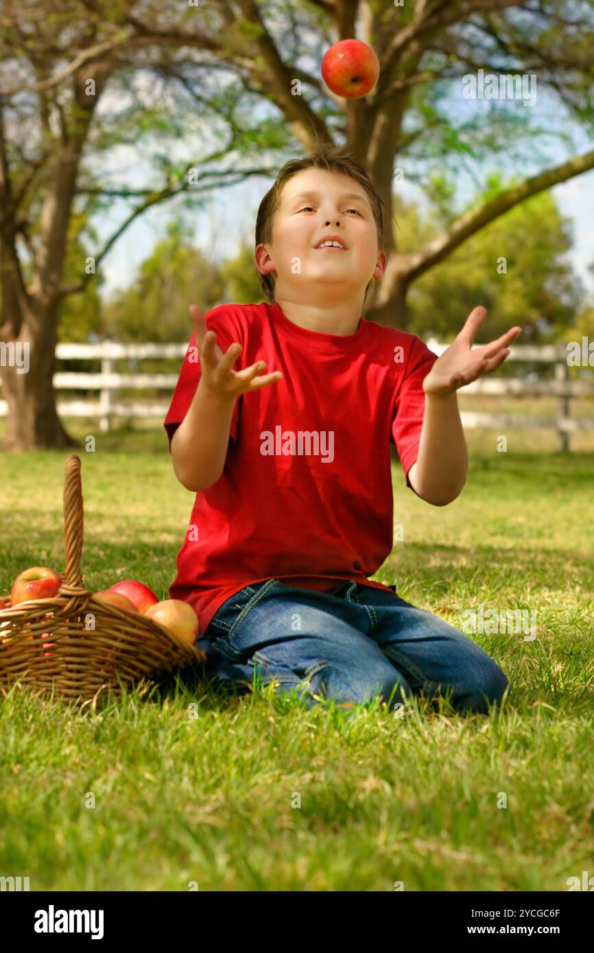 Boy throwing apple air hi-res stock photography and images - Alamy
