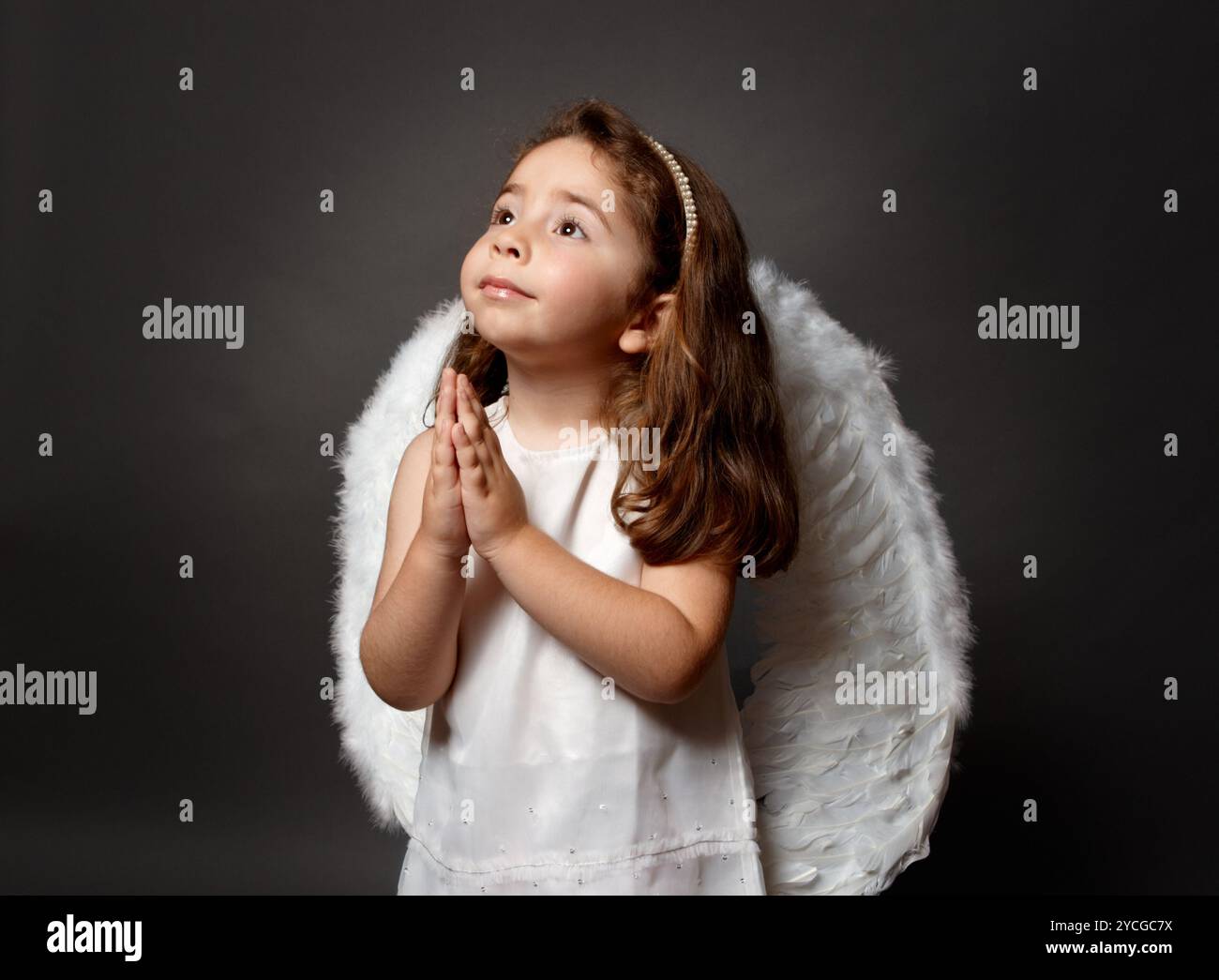 Holy angel praying Stock Photo - Alamy