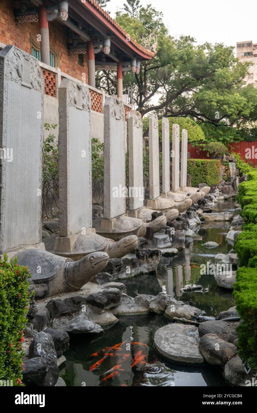 Turtles with Chikan Tower which is also named Fort Provintia in Tainan ...