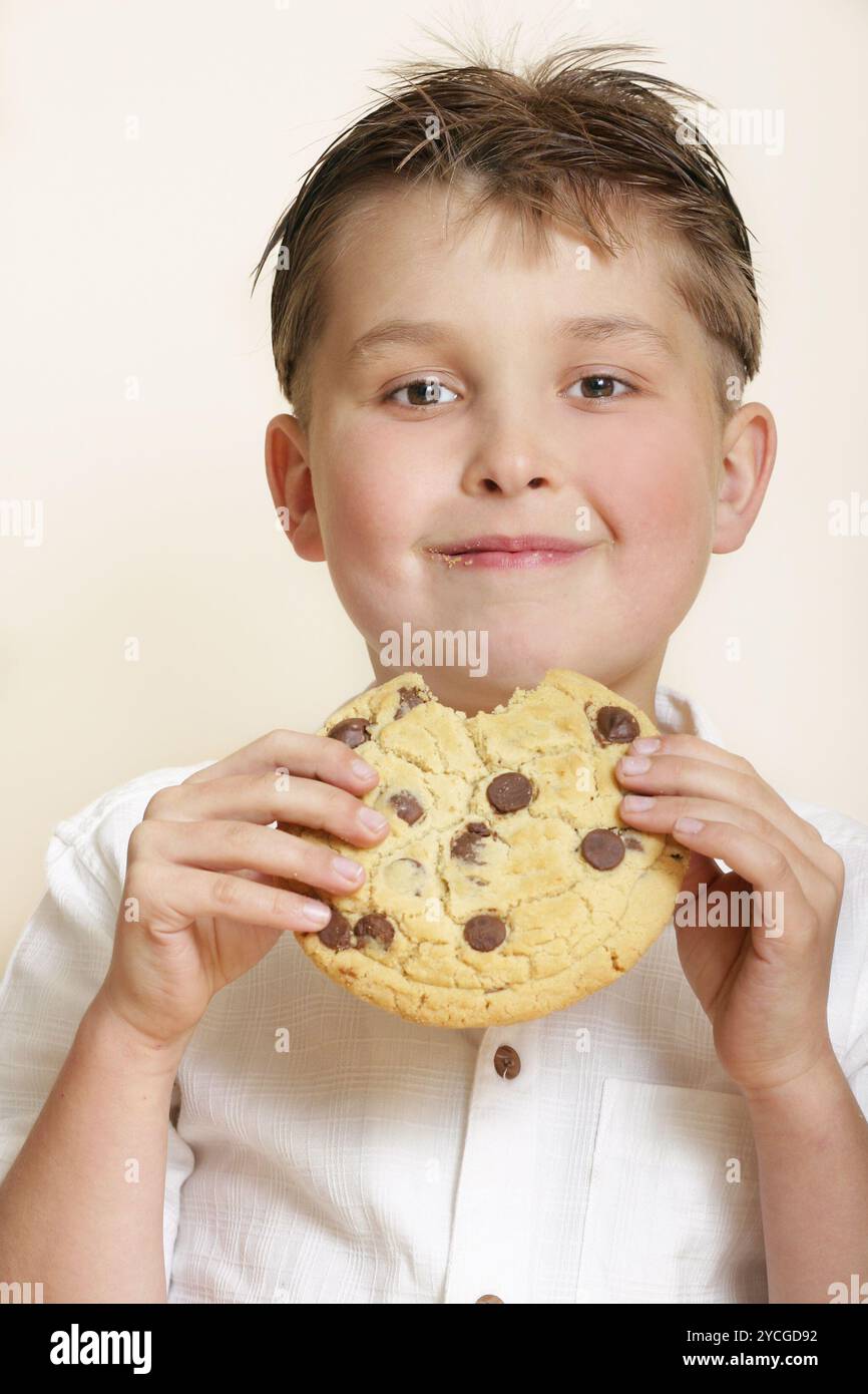 Boy eating biscuits hi-res stock photography and images - Alamy