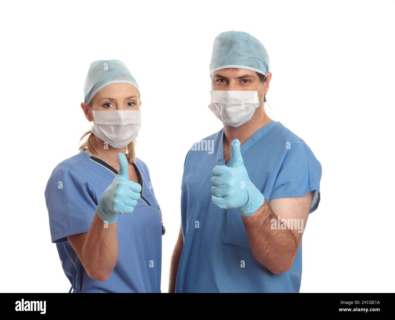 Two surgeons success thumbs up Stock Photo - Alamy