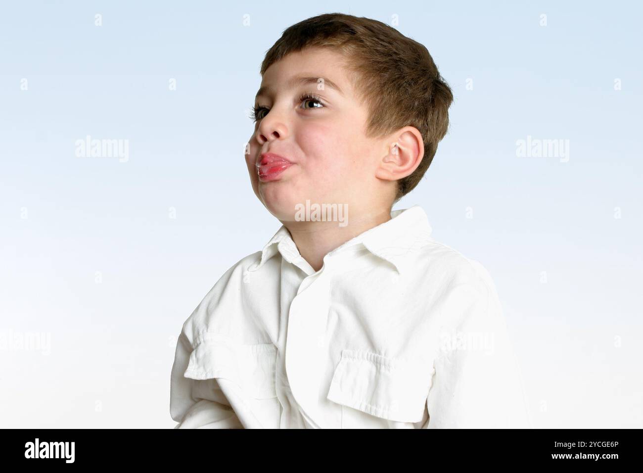 Child - boy blowing raspberries Stock Photo - Alamy