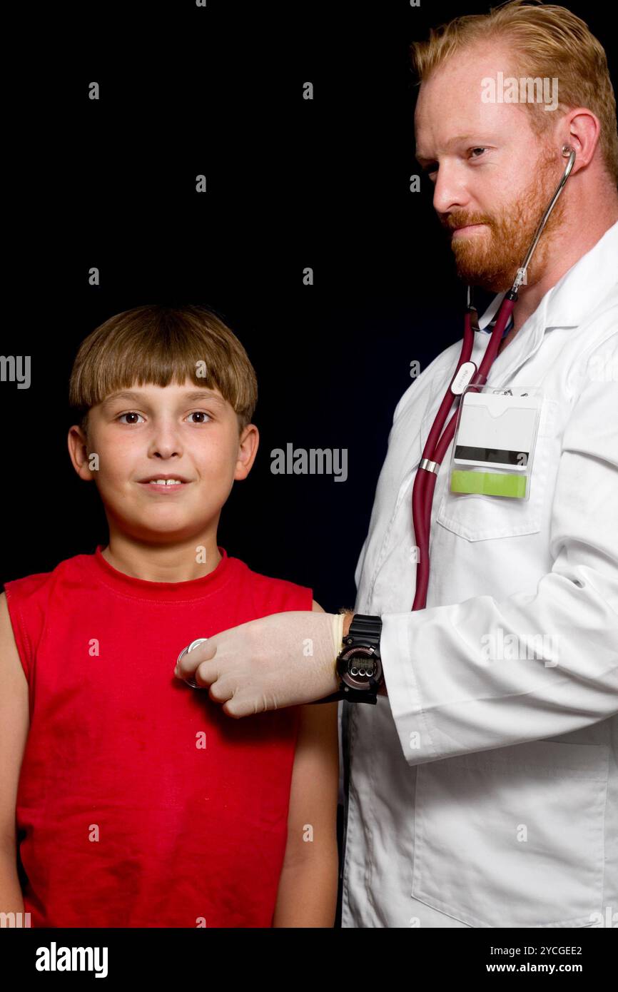 Doctor checking patient Stock Photo - Alamy