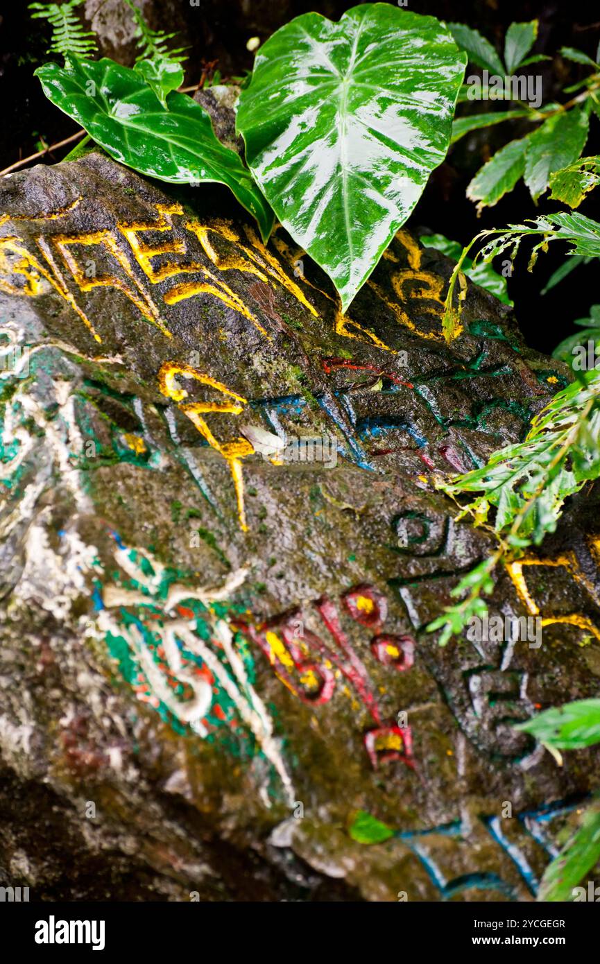 Buddhist prayer stone with mantra Stock Photo - Alamy