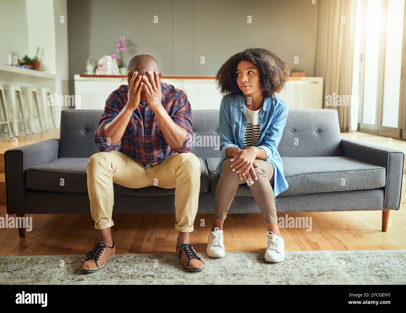 Apartment, couple and arguing in living room on sofa for disagreement ...