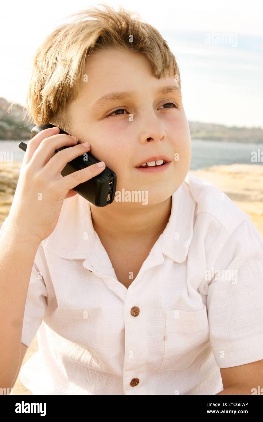 Boy using mobile phone Stock Photo - Alamy