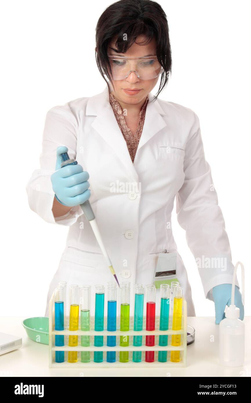 A woman with a fixed volume pipette and a rack of test tubes Stock ...