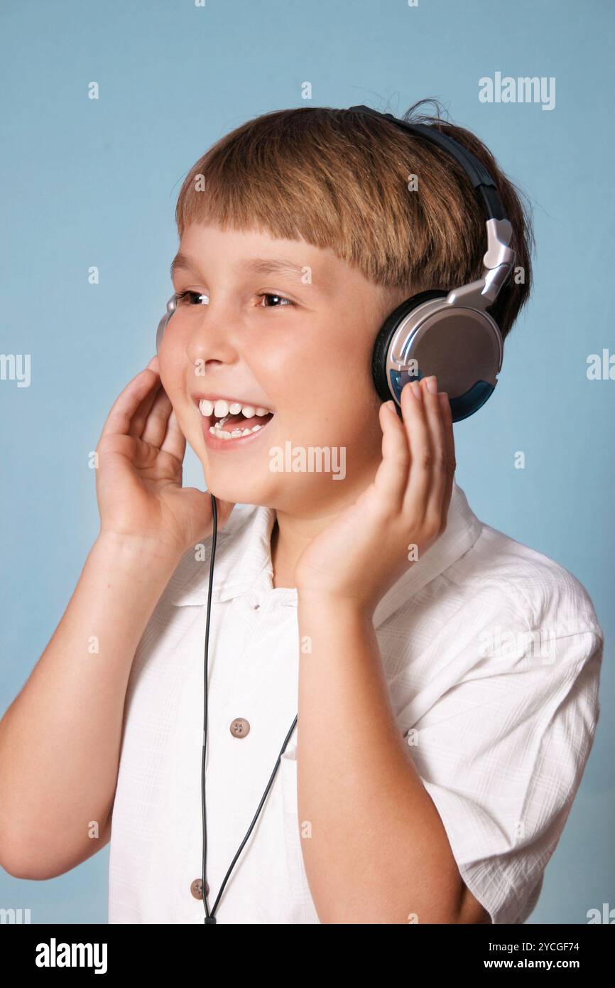 Boy listening music Stock Photo - Alamy