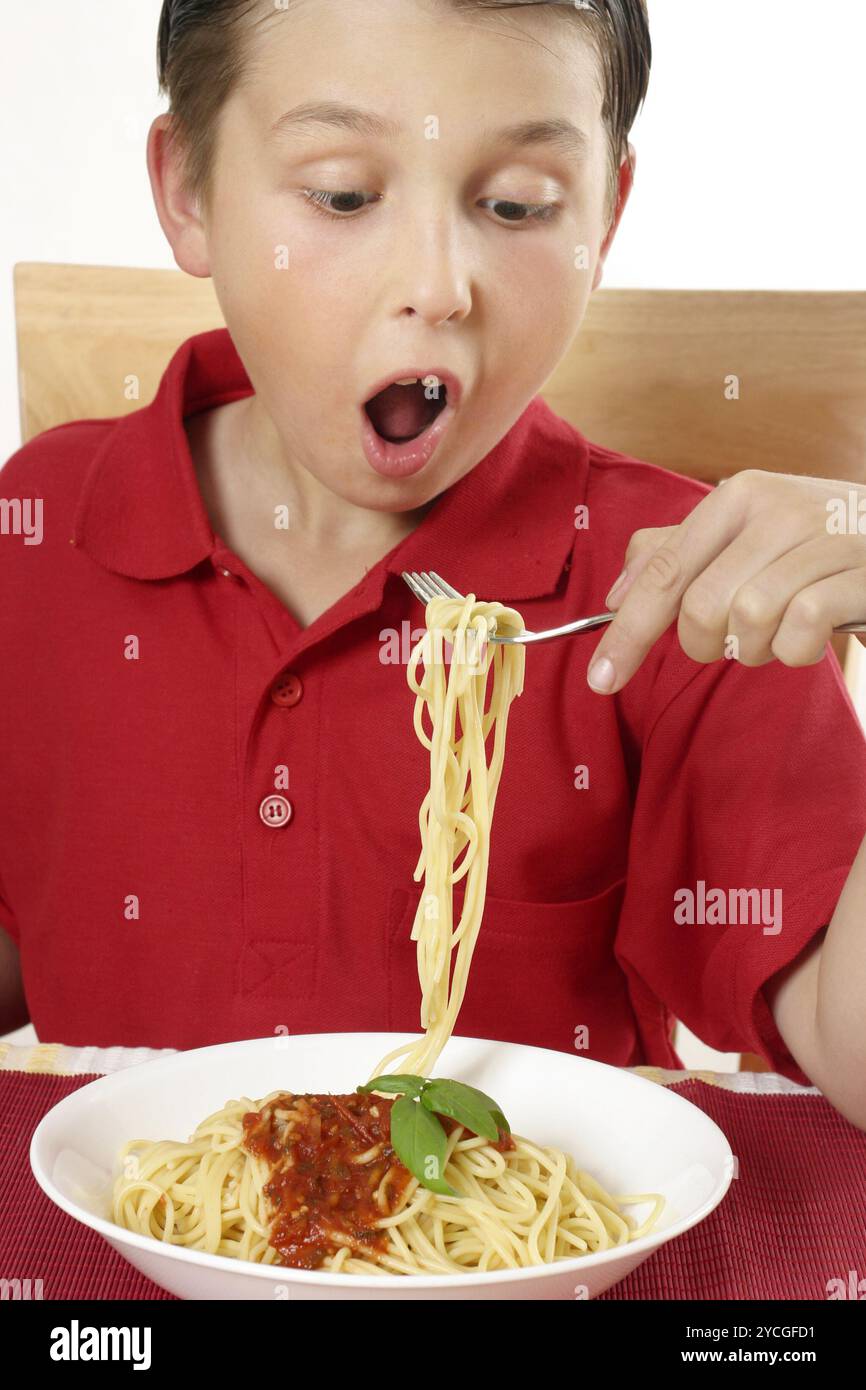 Child eating spaghetti pasta Stock Photo - Alamy