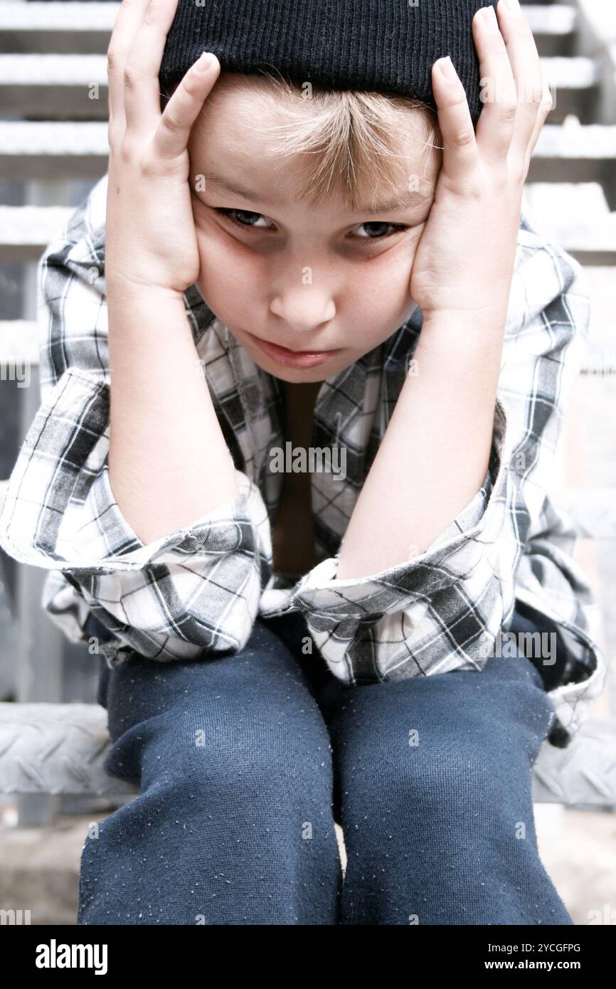 Street Kid feeling helpless Stock Photo - Alamy