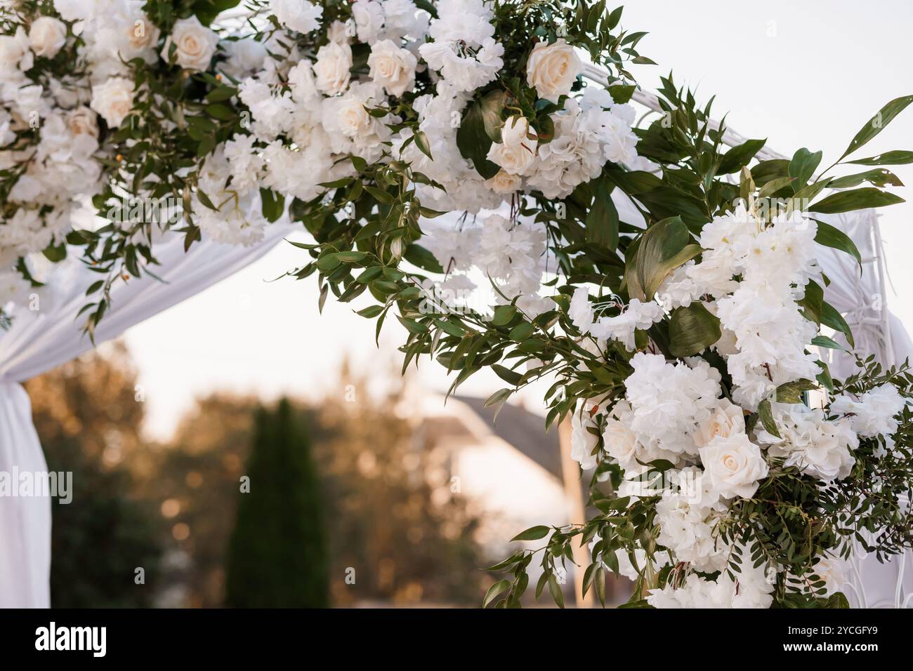 Elegant Floral Wedding Arch with White and Cream Blooms Stock Photo - Alamy