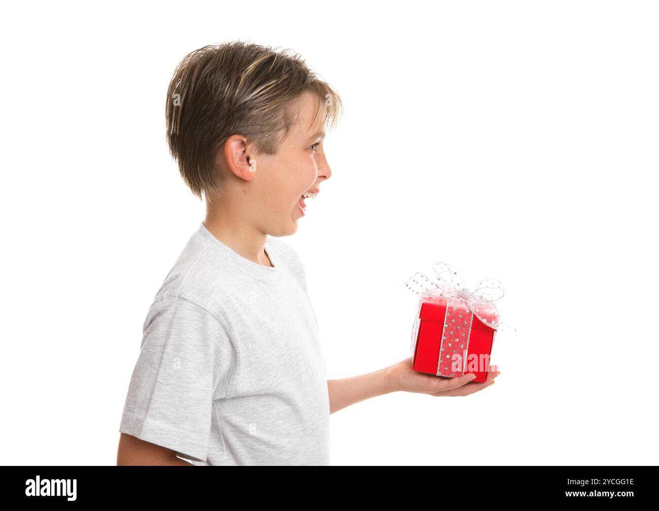 Boy with present - Joy of Christmas Giving Stock Photo - Alamy