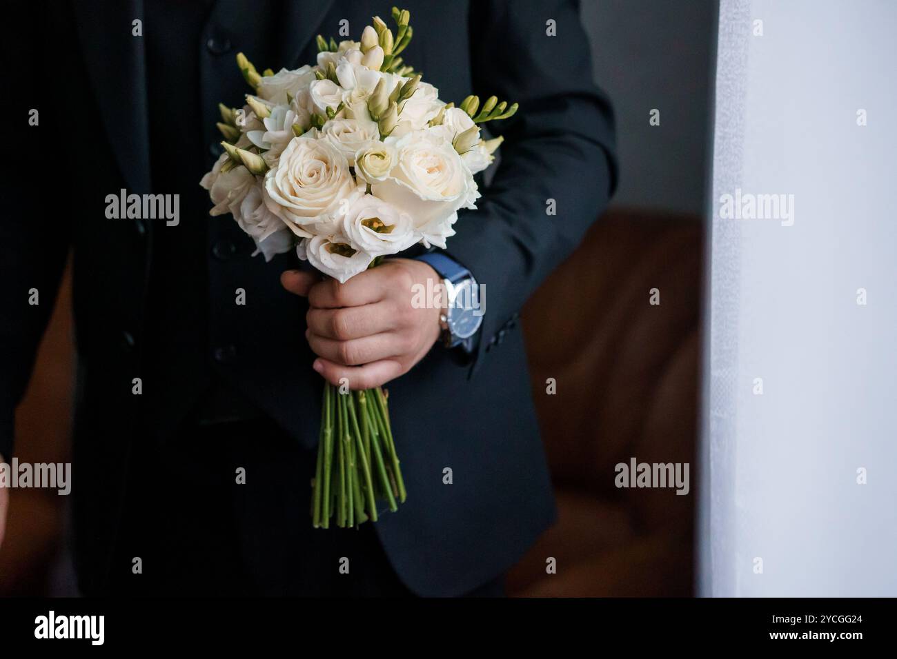 Elegant Bridal Bouquet Held by Dapper Suit-Clad Individual Stock Photo ...