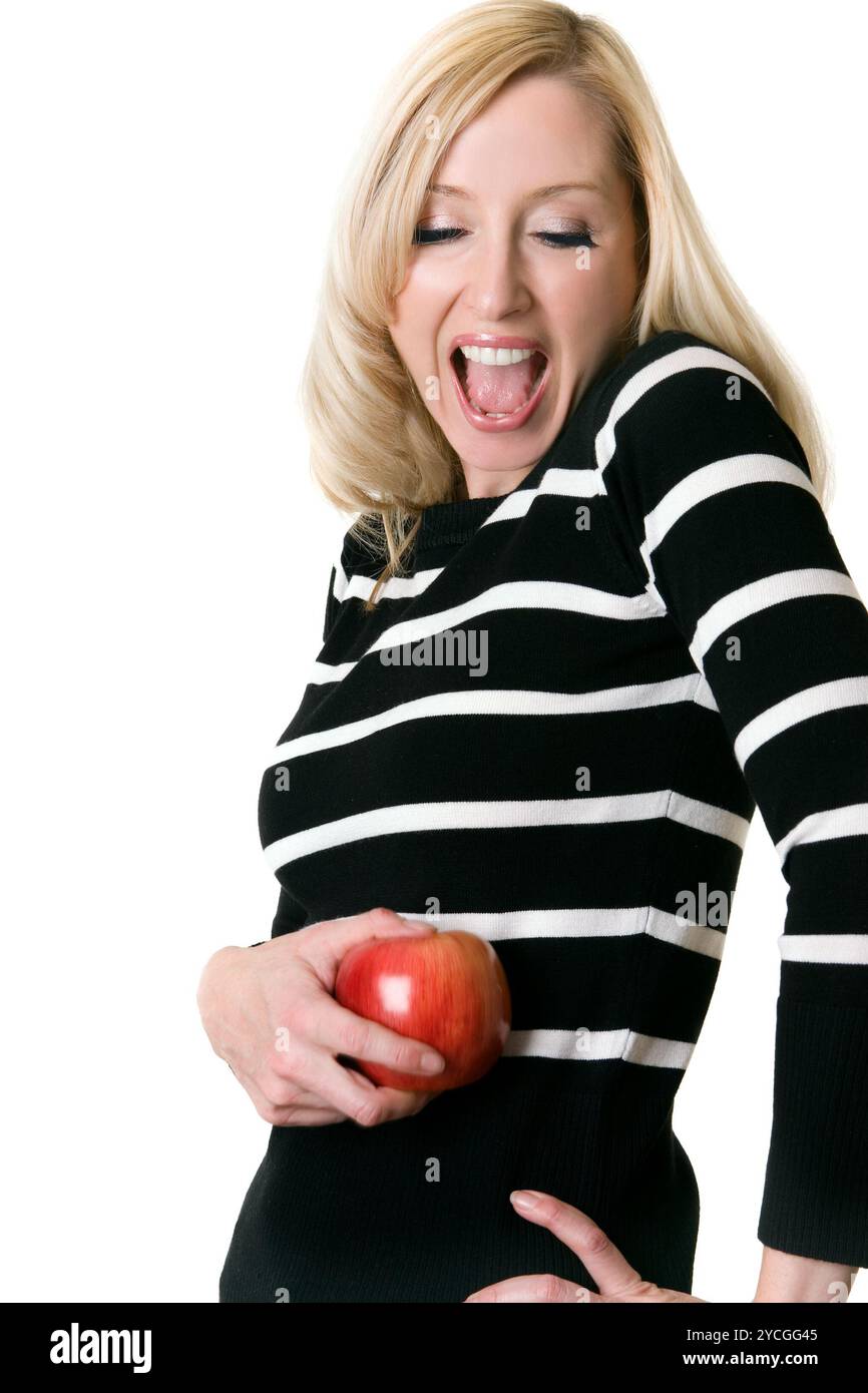 Woman shining a red apple. Motion in the apple Stock Photo - Alamy