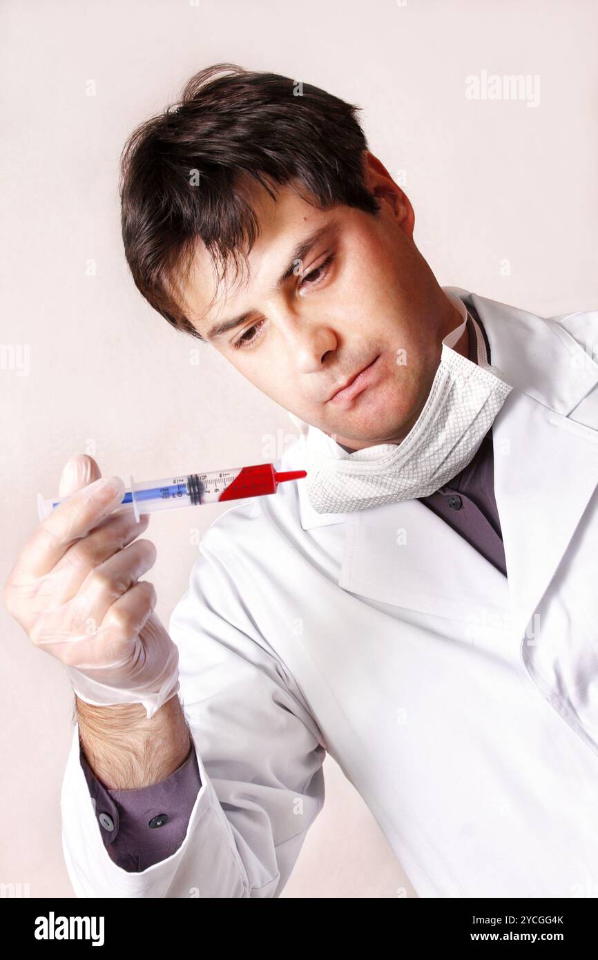 Doctor with syringe Stock Photo - Alamy