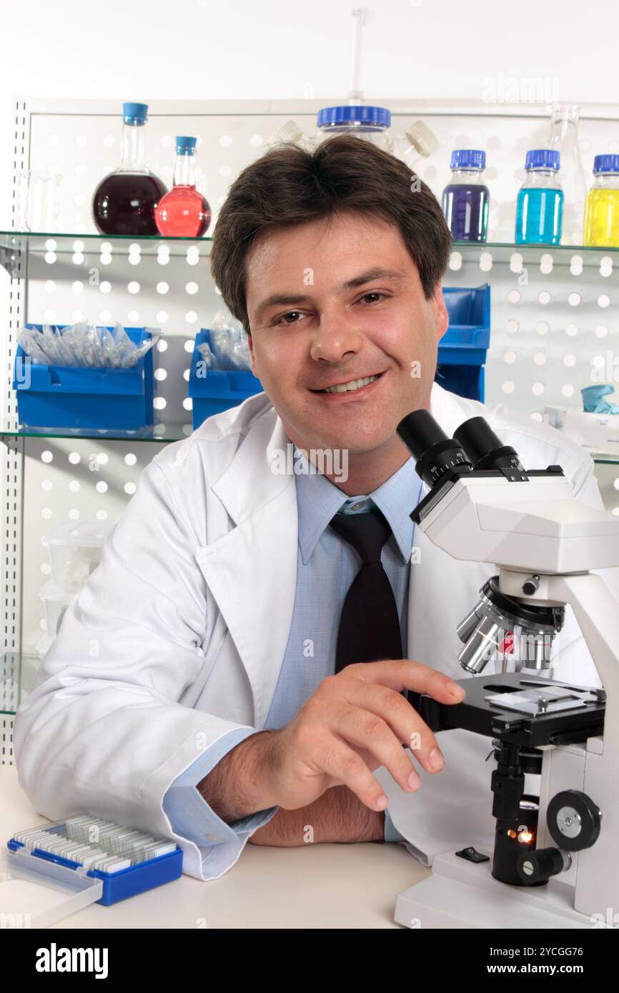 Researcher scientist sitting at laboratory desk Stock Photo - Alamy