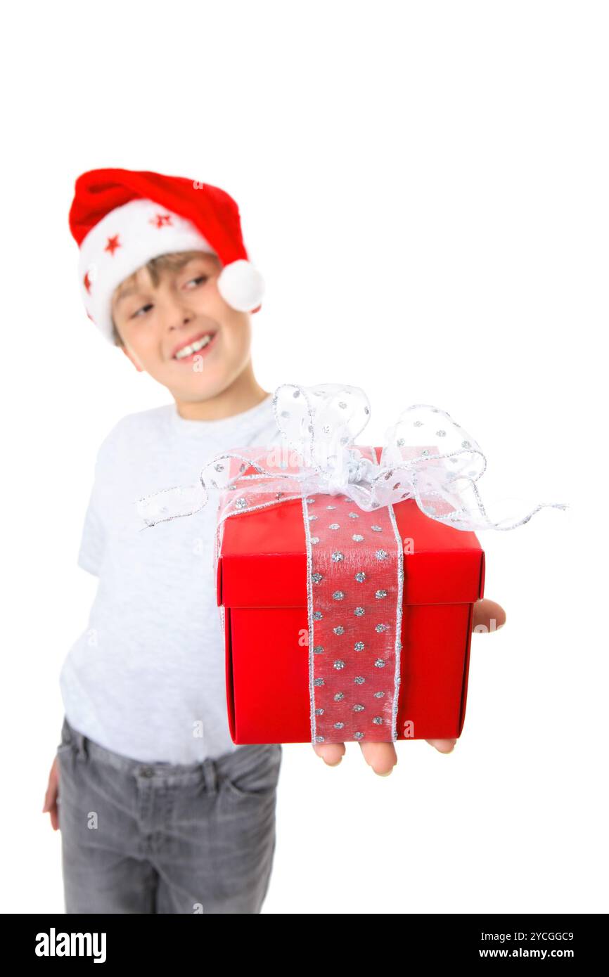 Boy with present looking sideways Stock Photo - Alamy