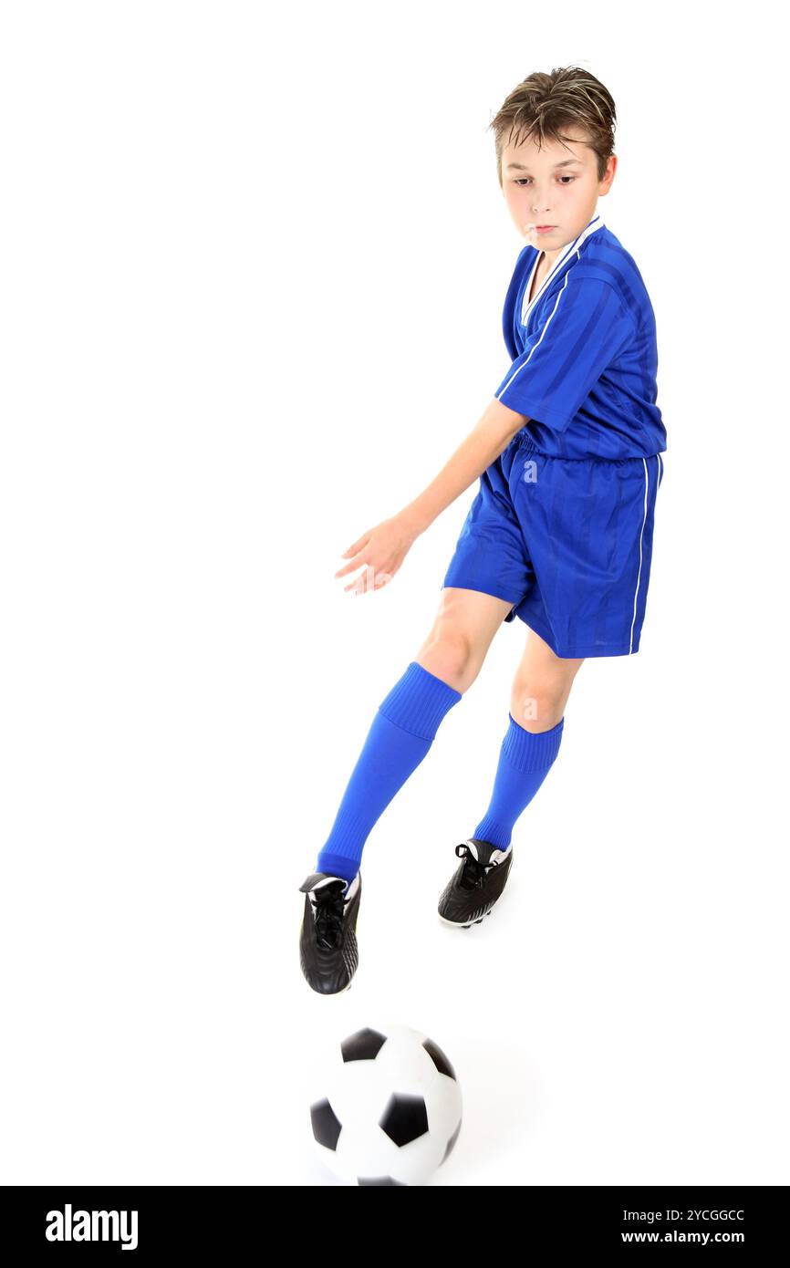 Child kicking ball Stock Photo - Alamy