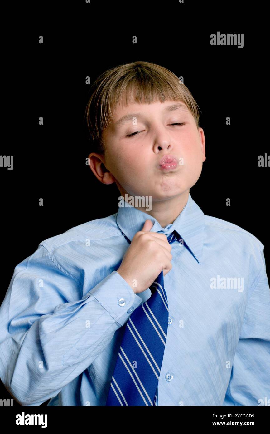 School boy adjusting tie Stock Photo - Alamy