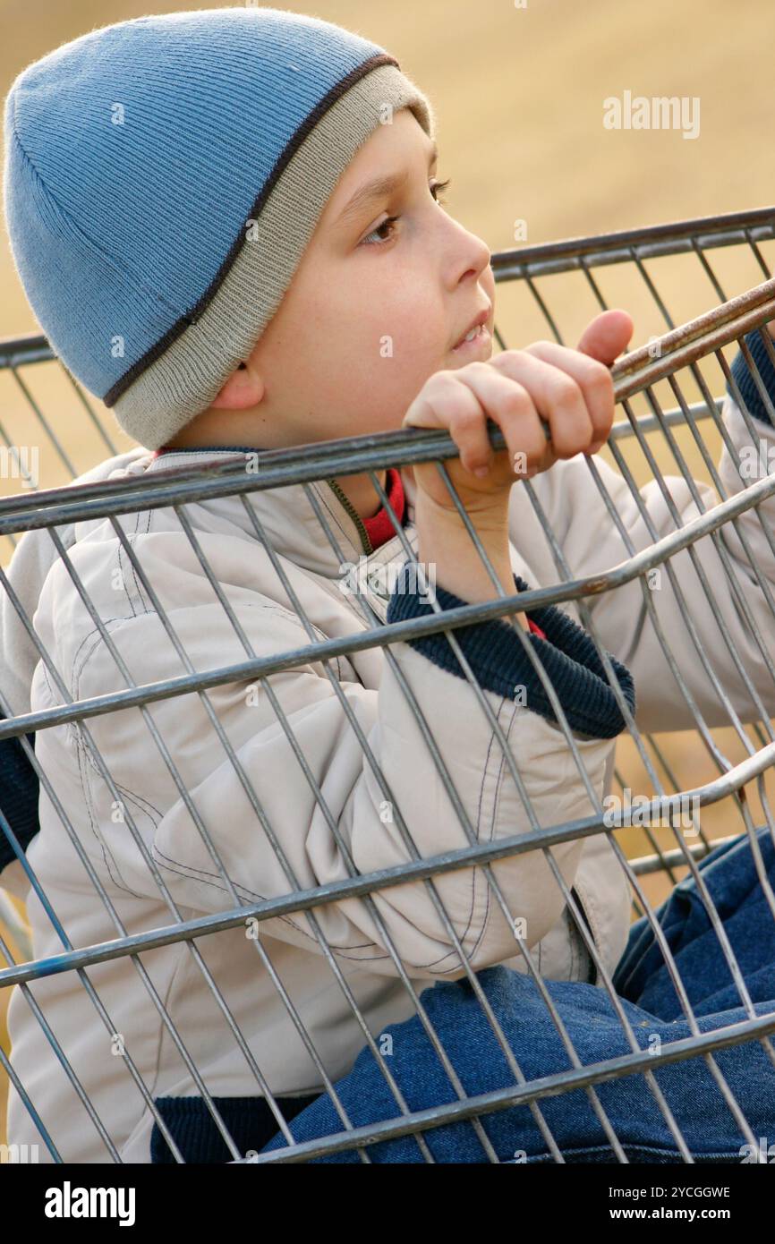 Child playing shopping trolley Stock Photo - Alamy