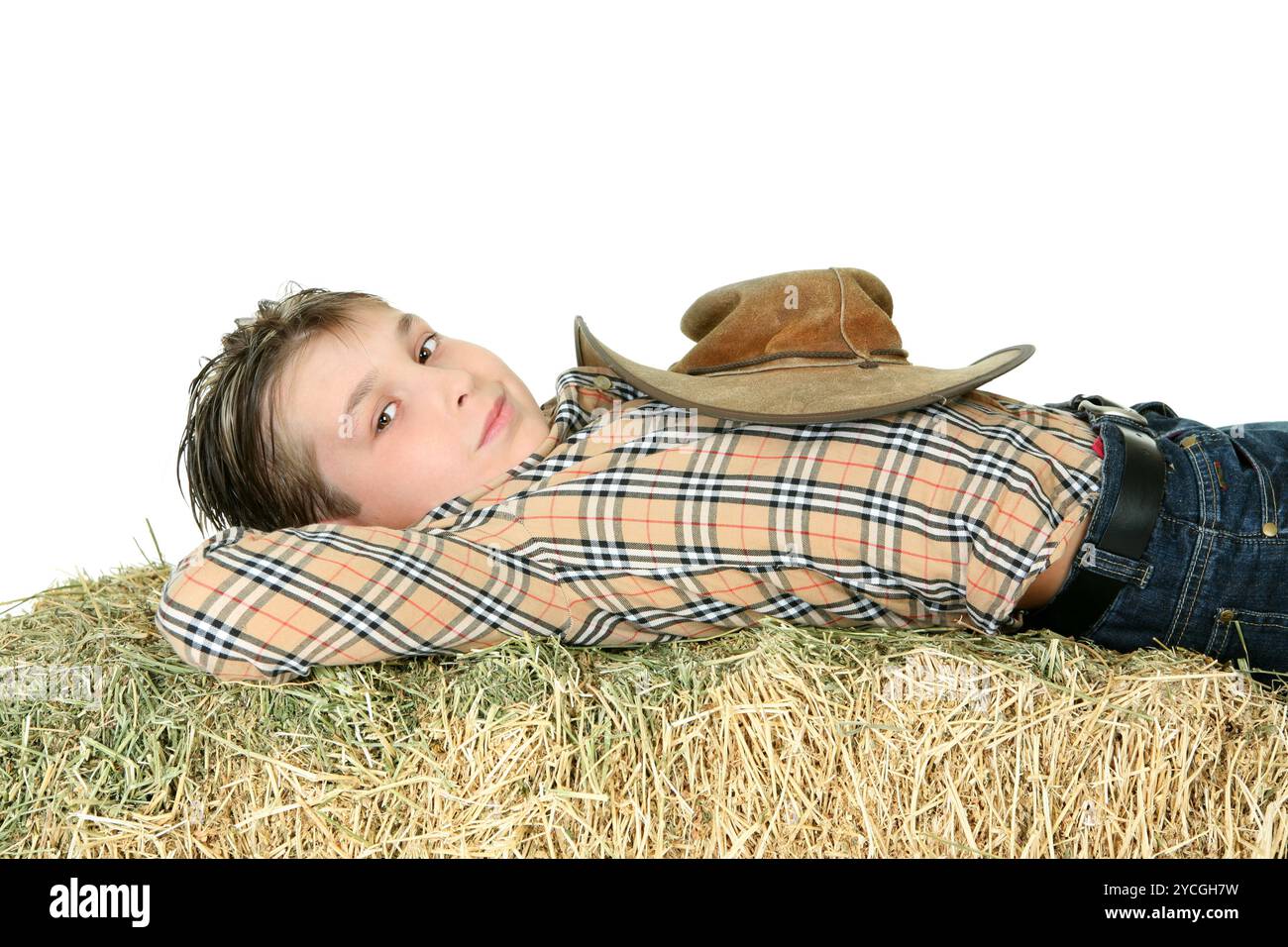Country boy resting on hay Stock Photo - Alamy