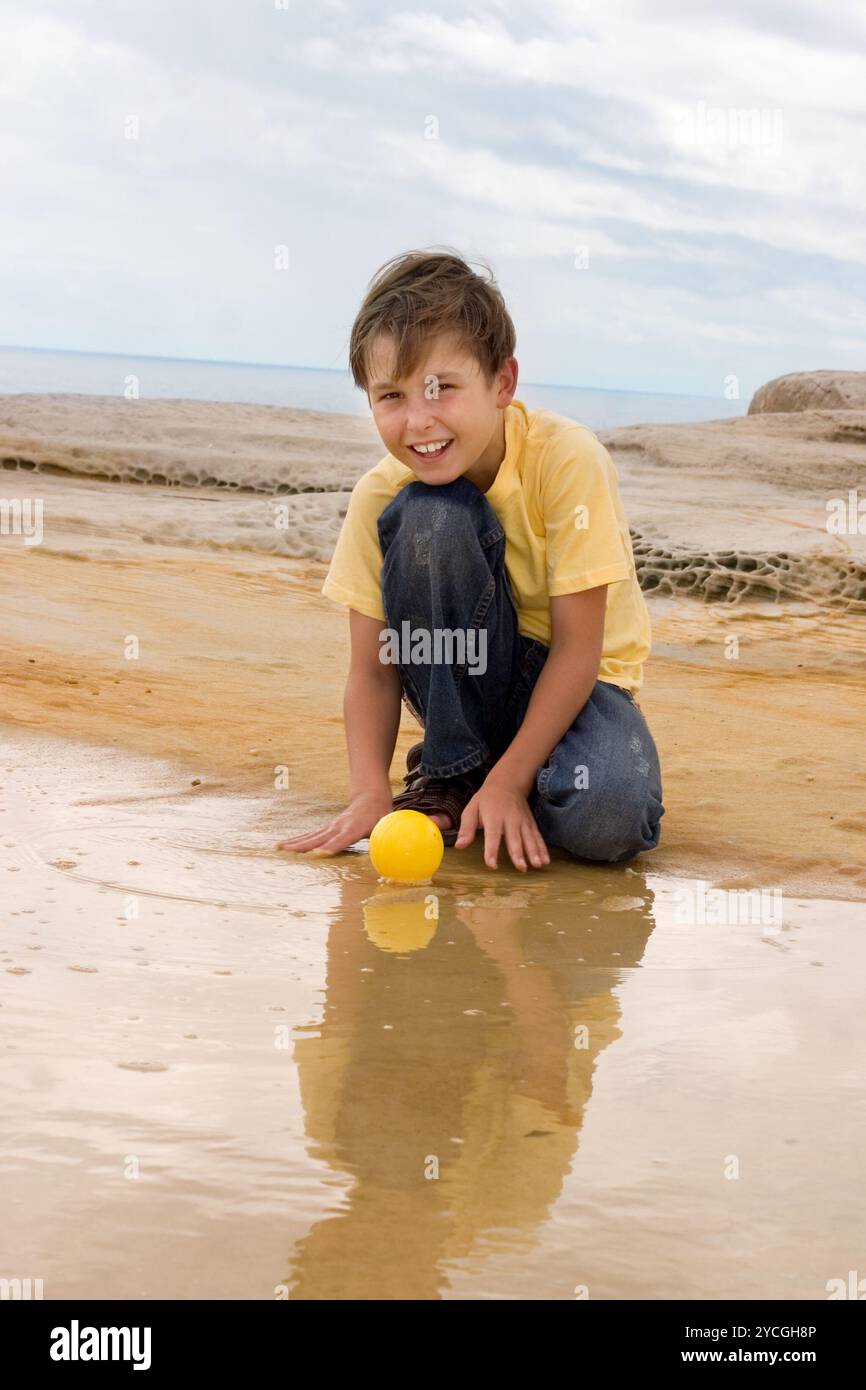 Child playing in ocean hi-res stock photography and images - Alamy