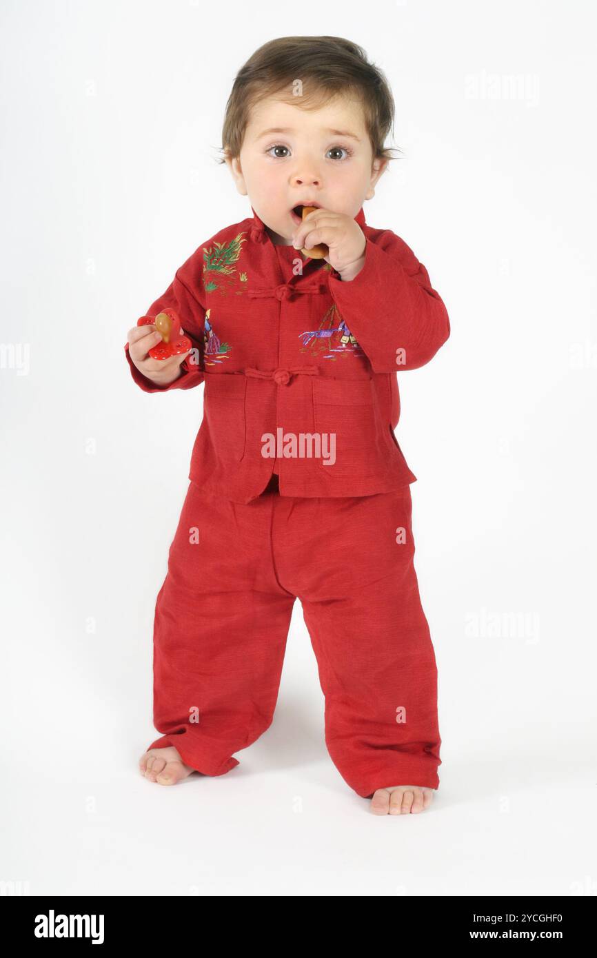 Standing baby eating TEETHING rusk Stock Photo - Alamy