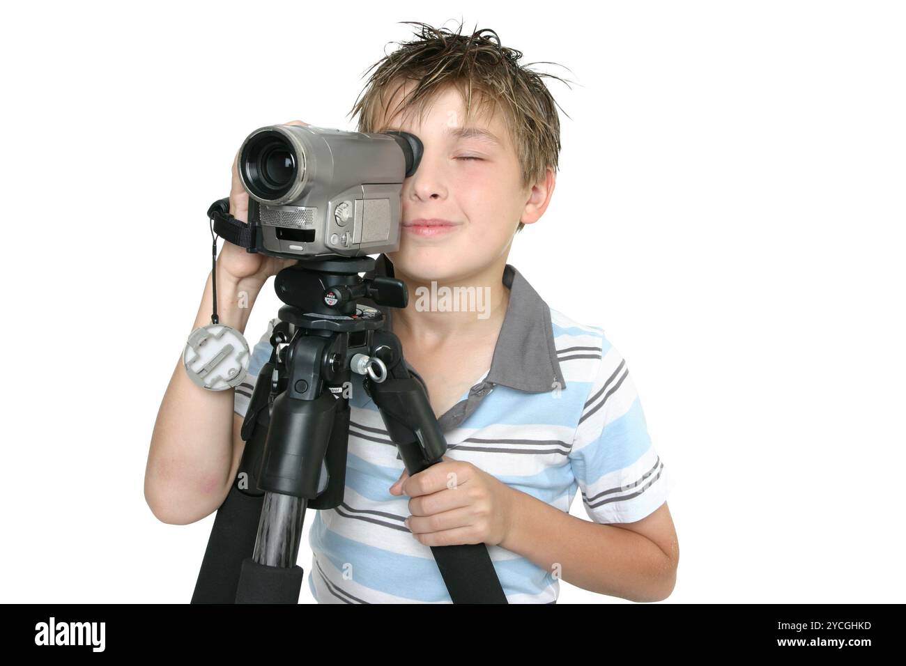 Child creating a short movie using video camera and tripod. Whtie ...