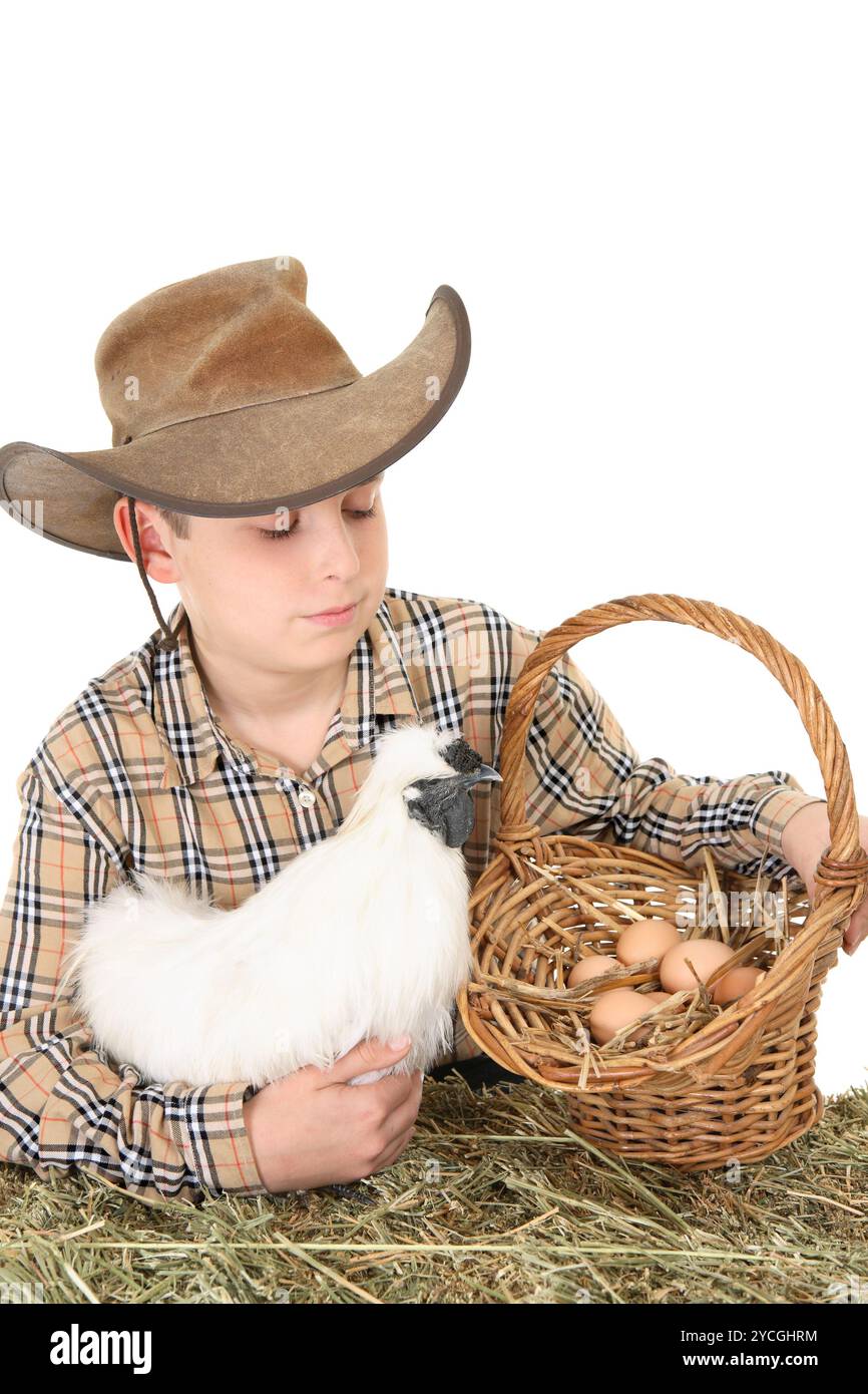 Farm boy with basket of eggs Stock Photo - Alamy