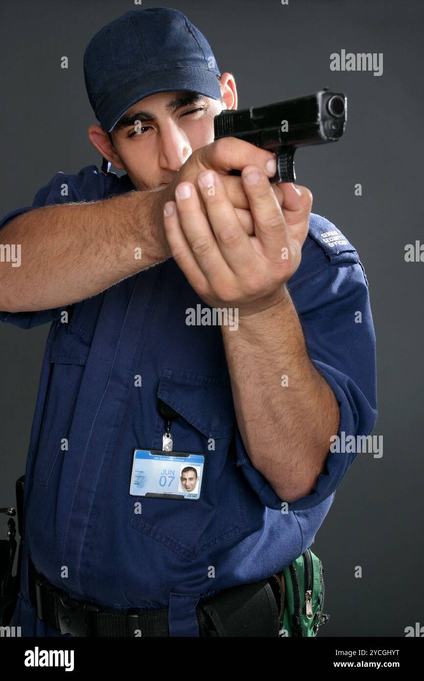 Security Officer takes aim Stock Photo - Alamy