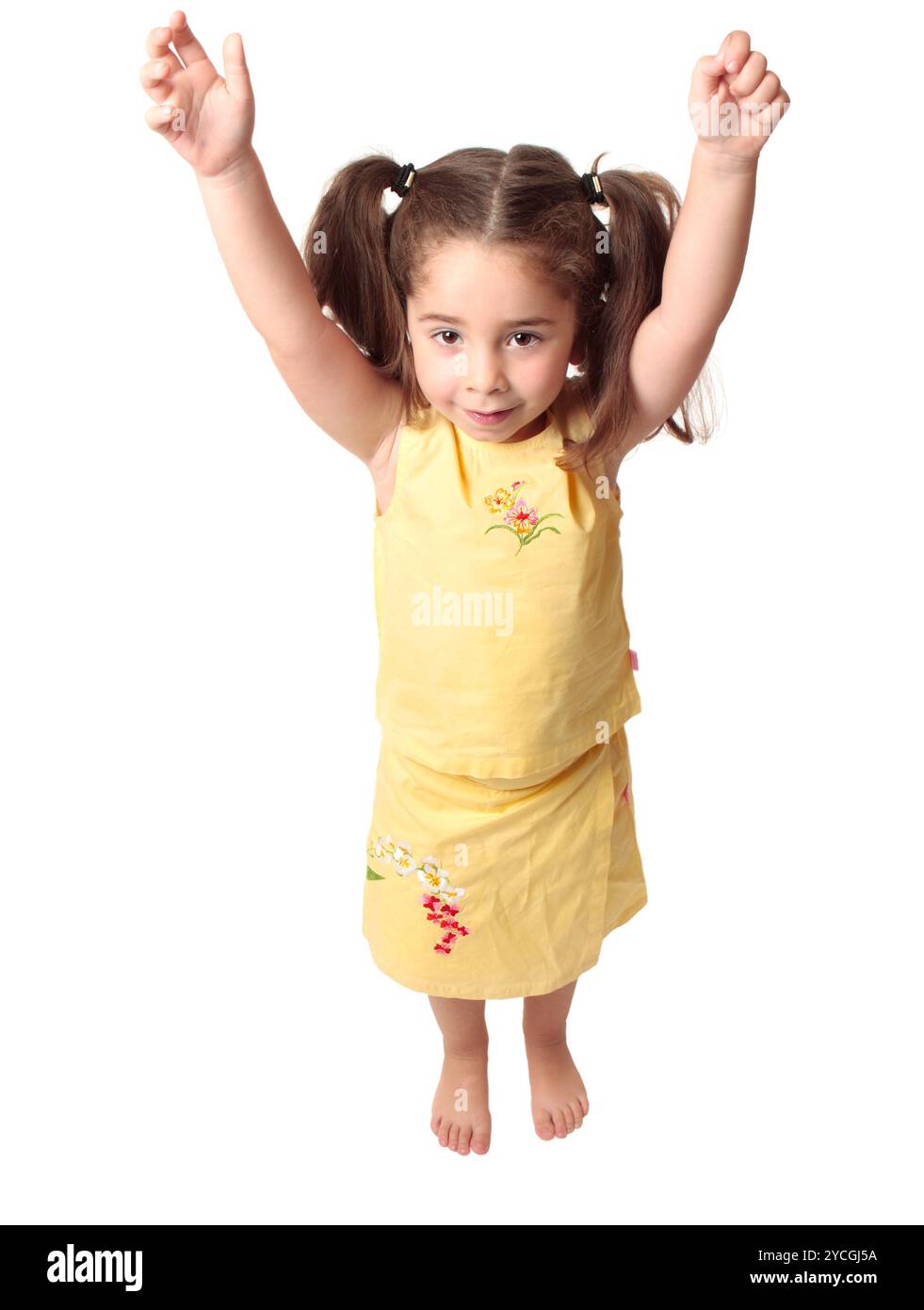 Preschool girl with arms raised above head Stock Photo - Alamy