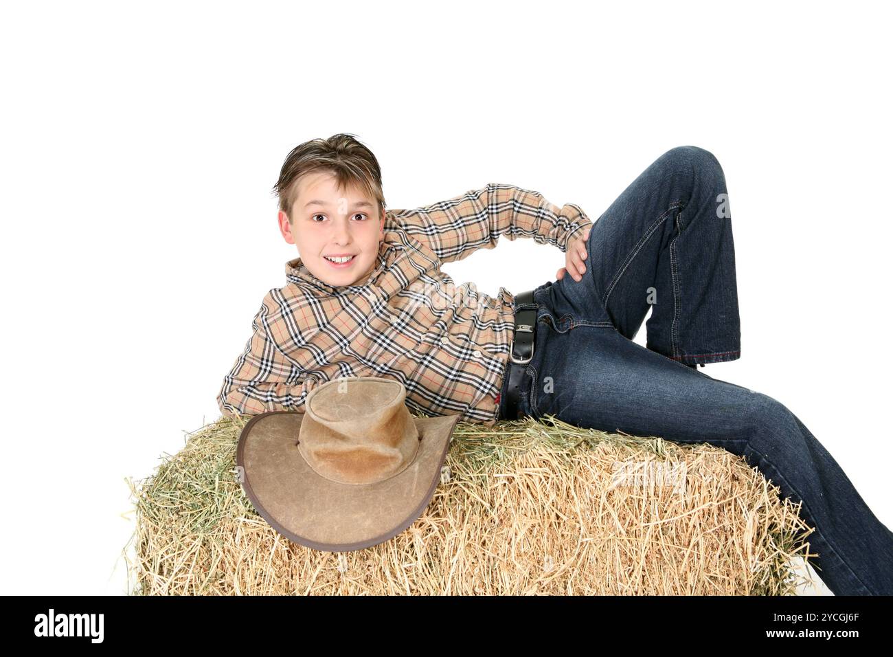 Rural child from the country lying on hay bale Stock Photo - Alamy