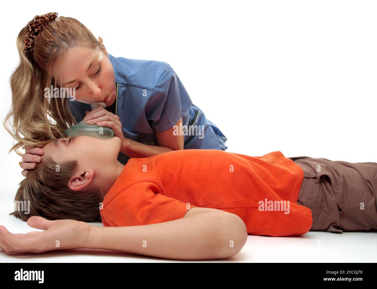 Resuscitating unconscious boy Stock Photo - Alamy