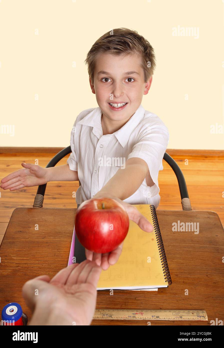 Student giving teacher an apple Stock Photo - Alamy