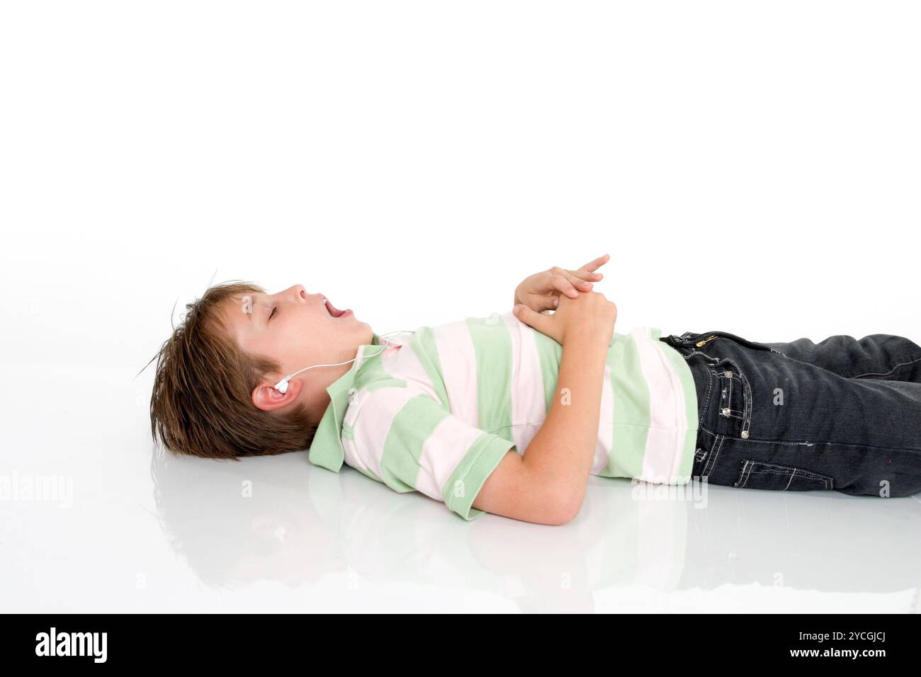 Child listing to music Stock Photo - Alamy