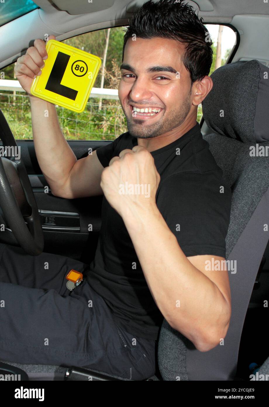 Happy male learner driver Stock Photo - Alamy
