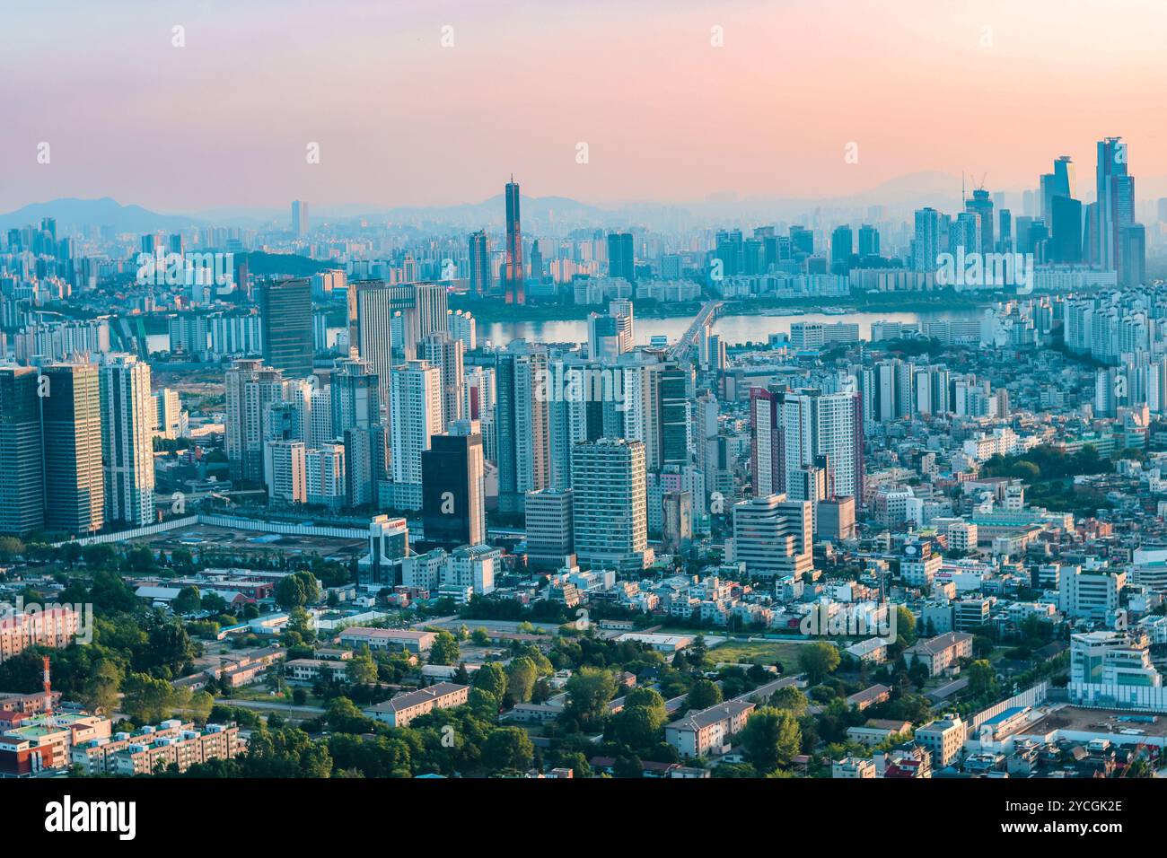 Sunset panoramic view of Seoul city and green forest from Namsan Tower ...