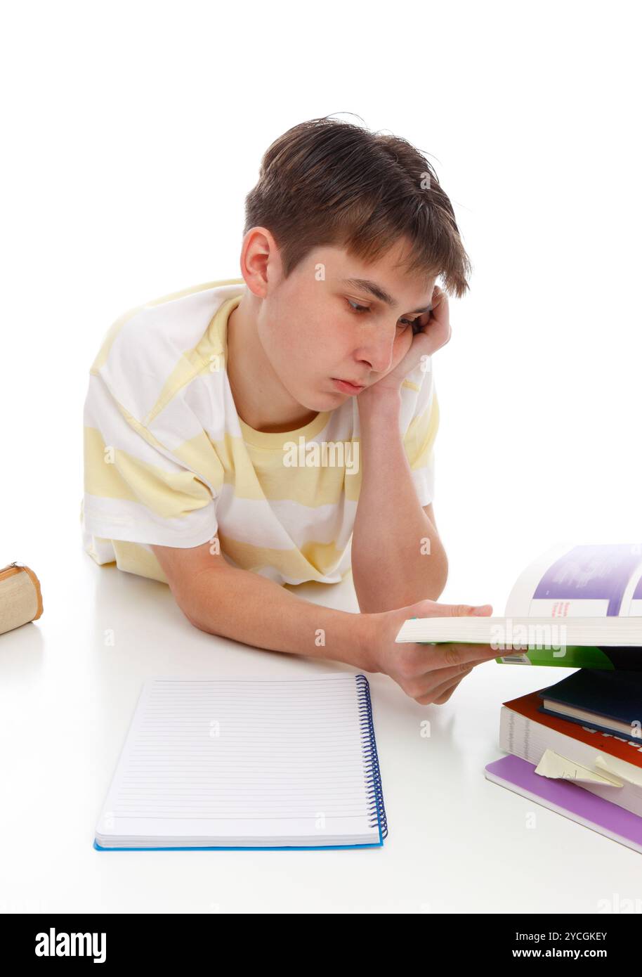 Boy reading studying textbooks Stock Photo - Alamy