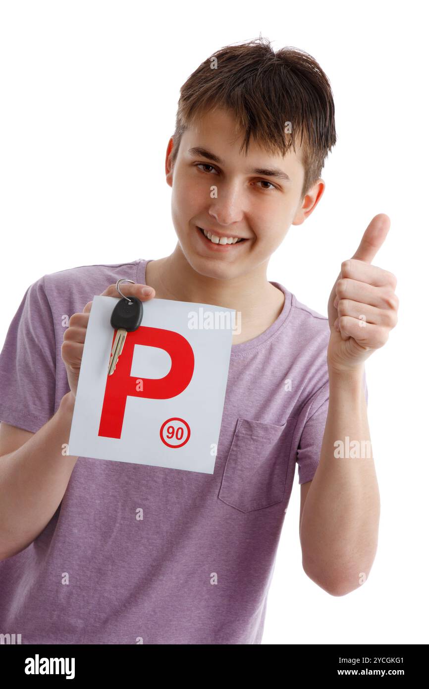 Teen boy holding P plates and car key Stock Photo - Alamy
